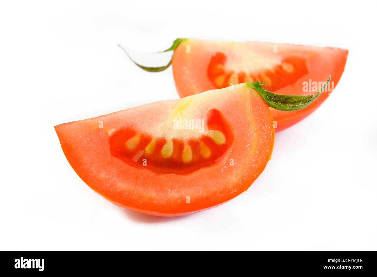 sliced tomato isolated on white background Stock Photo - Alamy