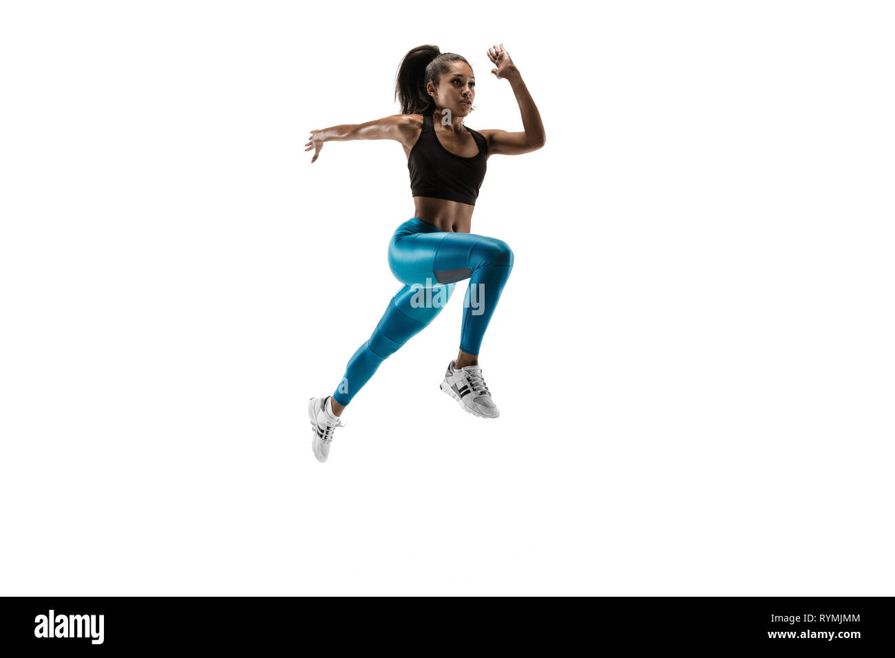 Young african woman running isolated on white studio background. One ...