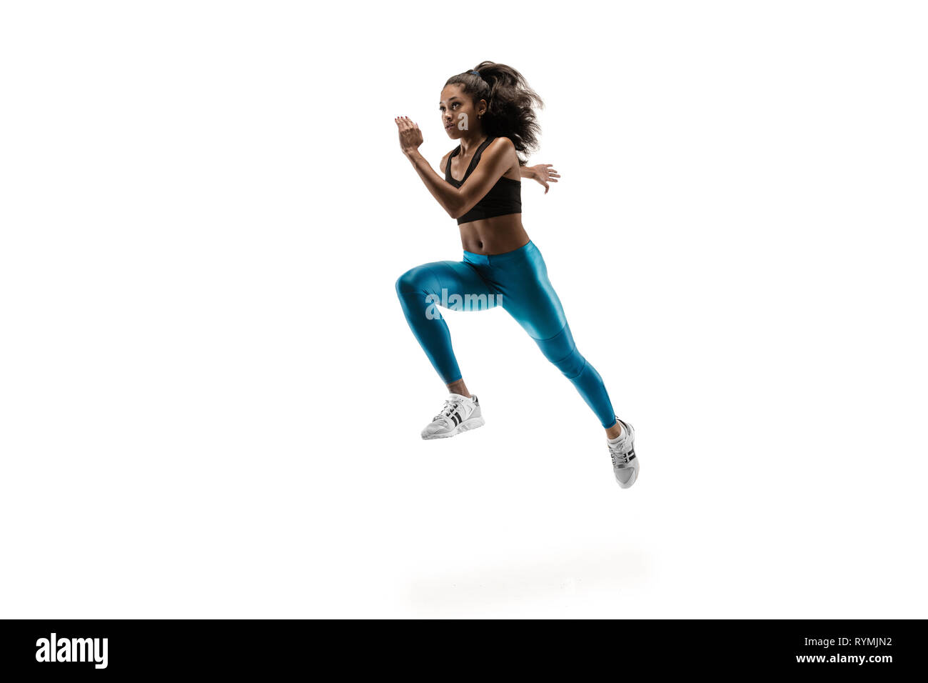 Young african woman running isolated on white studio background. One ...