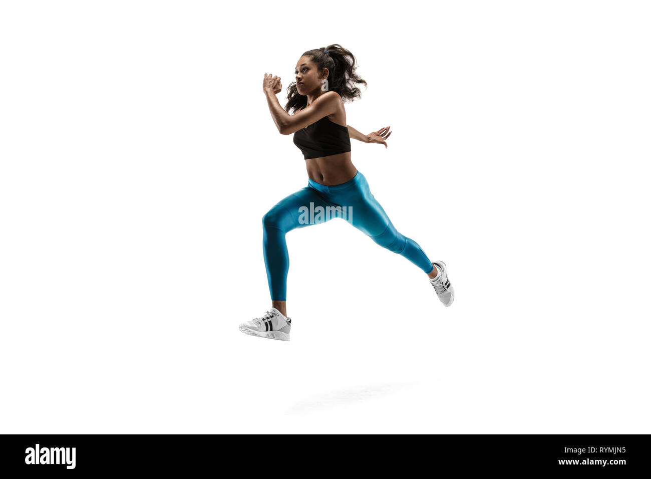 Young african woman running isolated on white studio background. One ...