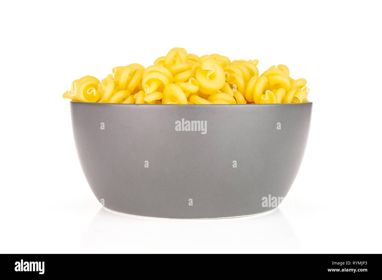 Lot of whole raw pasta funghetto variety in a grey ceramic bowl ...