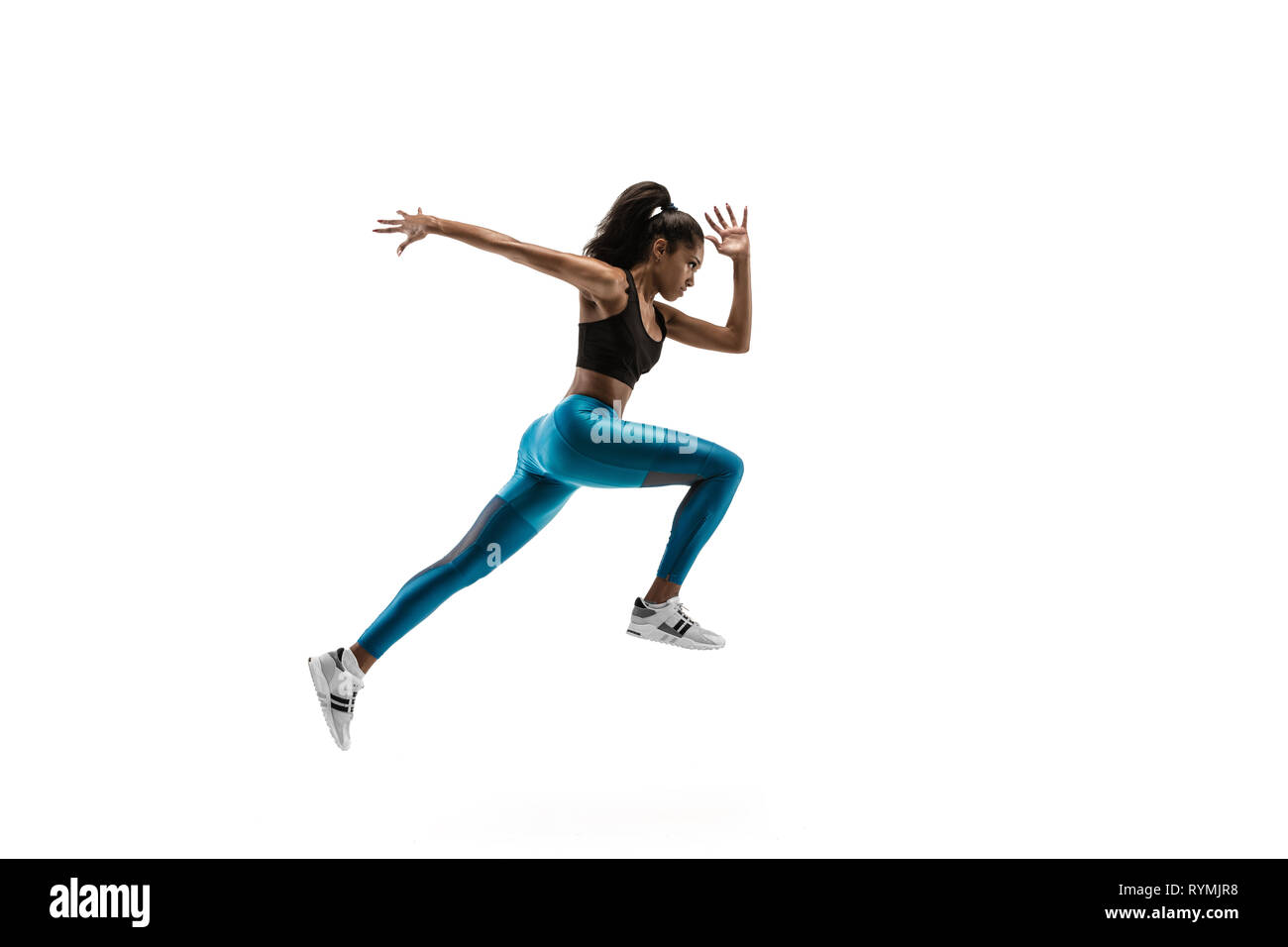 Young african woman running isolated on white studio background. One ...