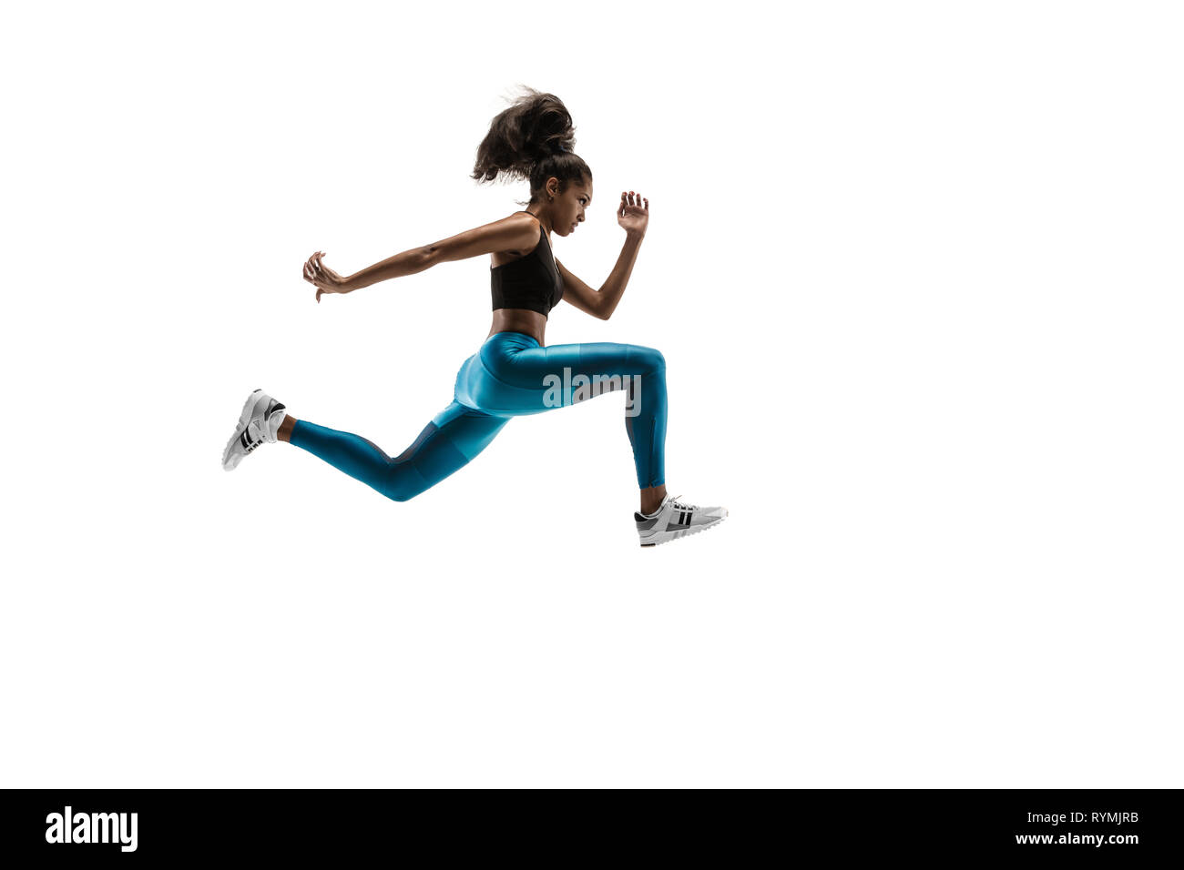 Young african woman running isolated on white studio background. One ...