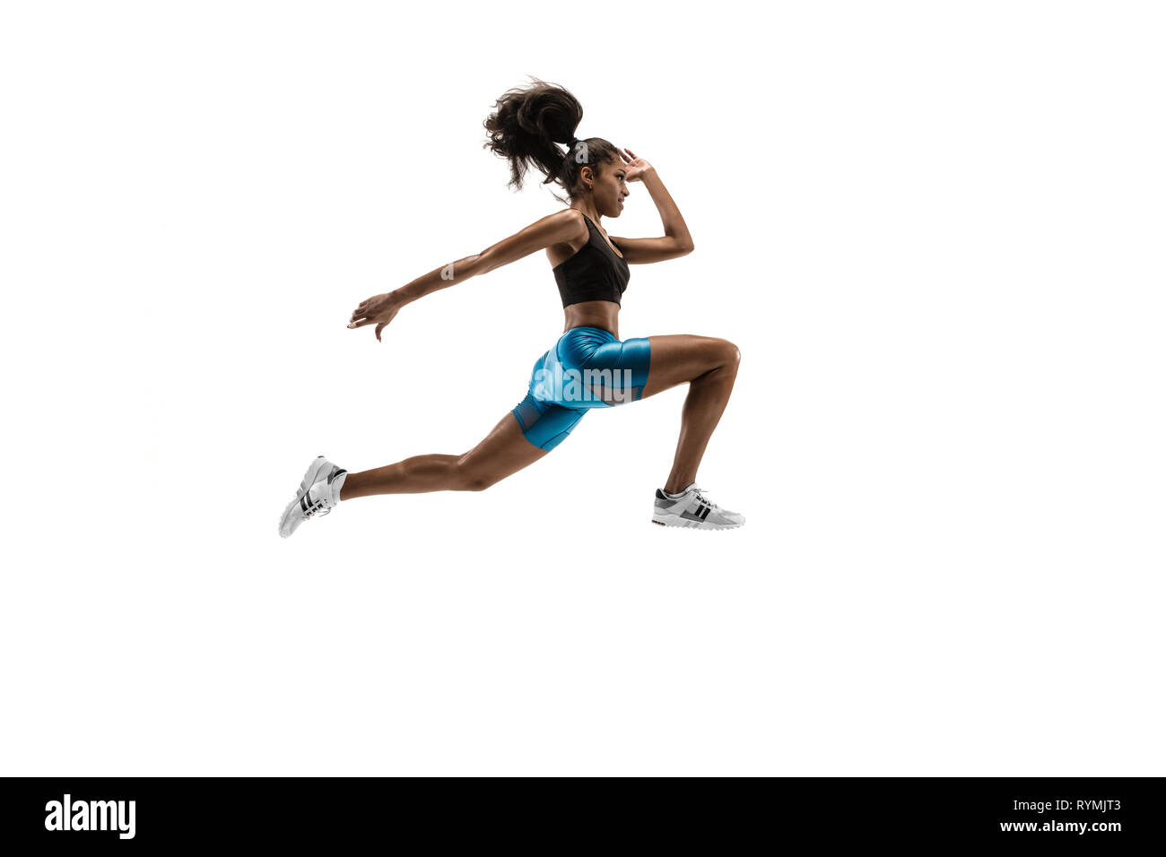 Young african woman running isolated on white studio background. One ...