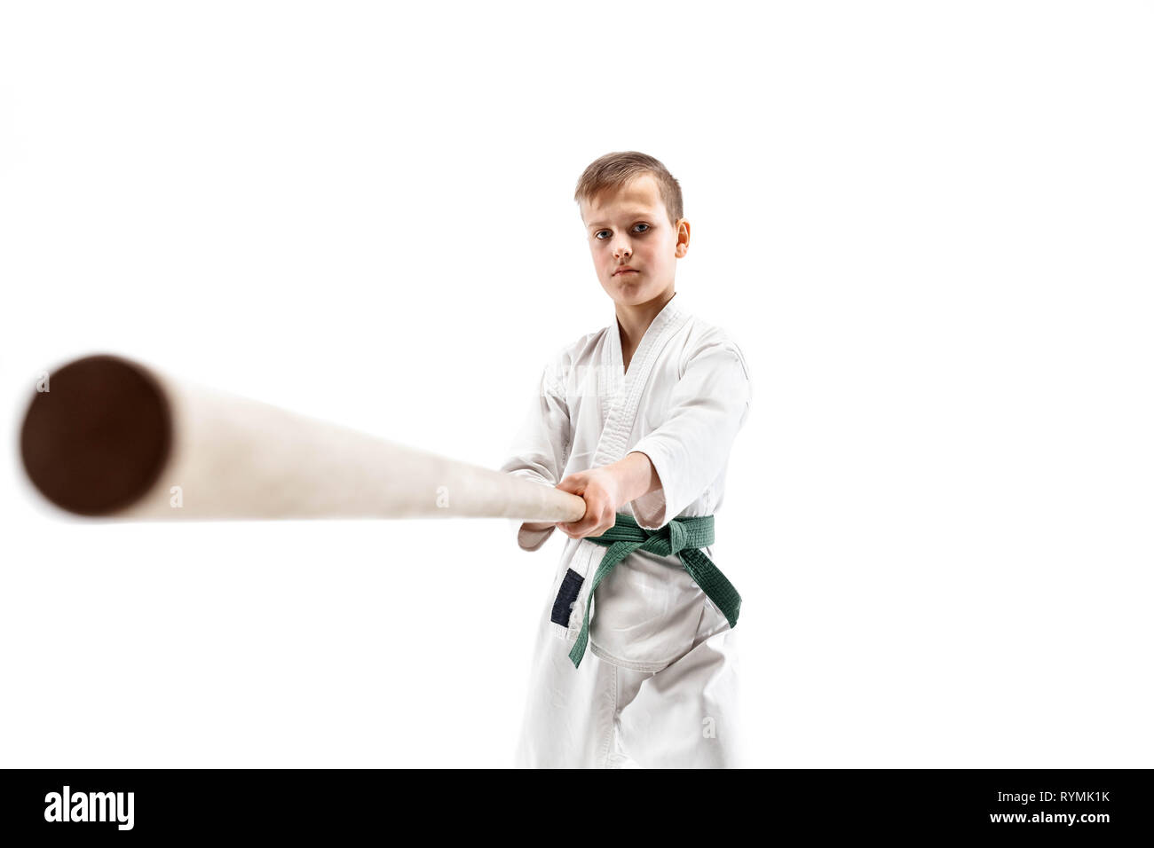 Teen boy fighting with wooden sword at Aikido training in martial arts ...