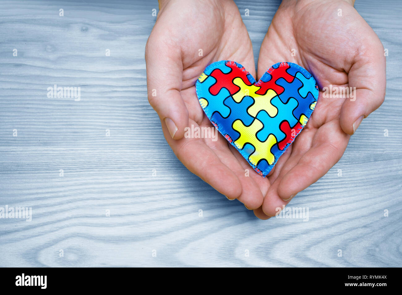 World Autism Awareness day, puzzle or jigsaw pattern on heart with ...