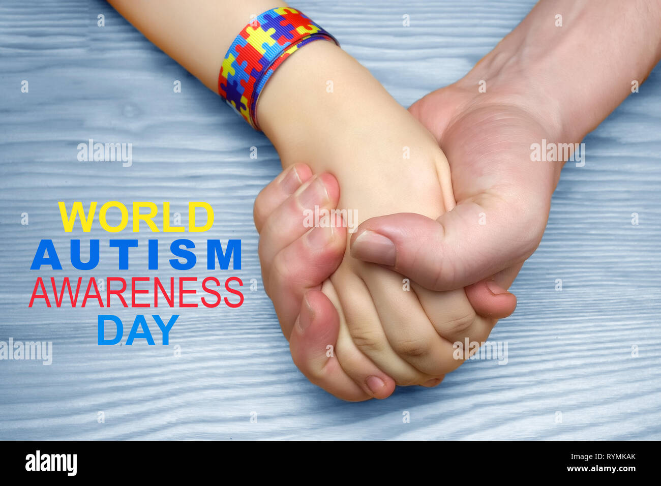 Autism Awareness Picture. Father holding hand his autistic child Stock ...