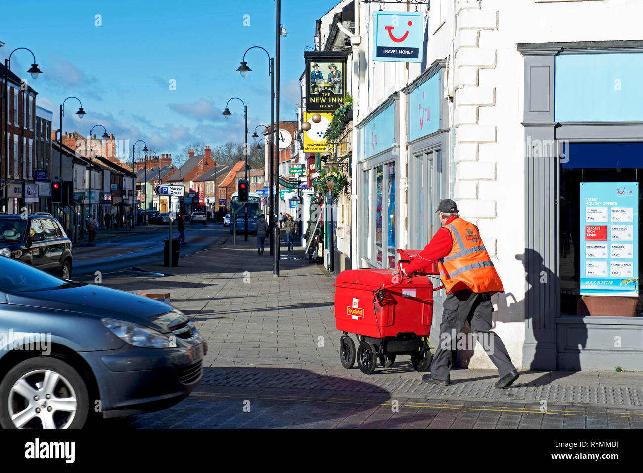 Postman in Selby, North Yorkshire, England UK Stock Photo - Alamy