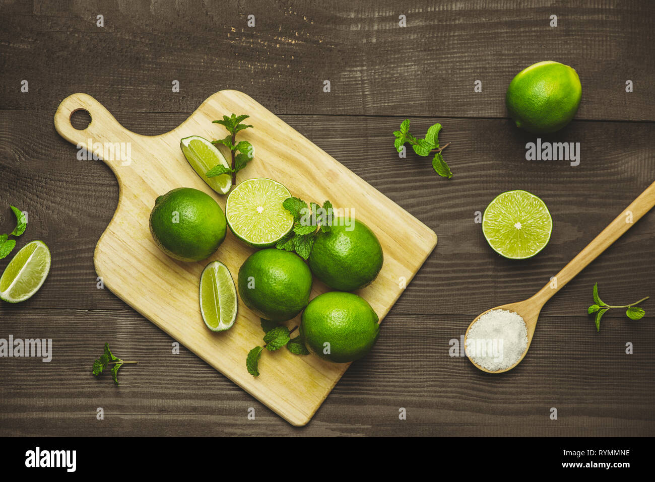 Fresh sliced lime and salt on wood table Stock Photo - Alamy