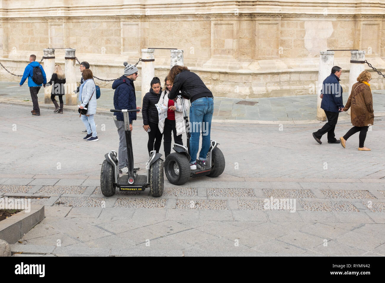 Tourists being shown how to use Segway scooters in Plaza del Triunfo by ...