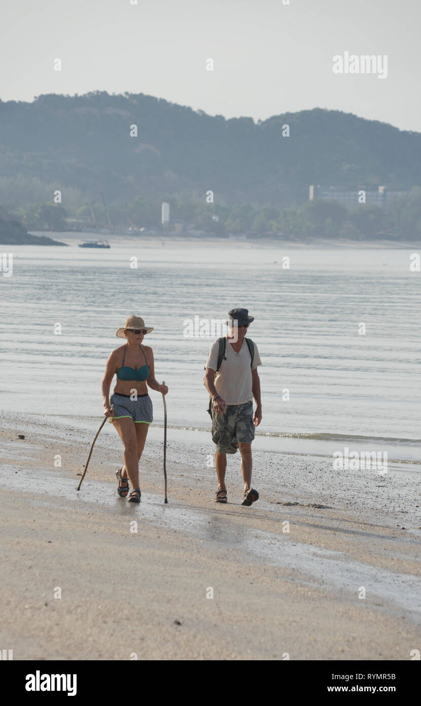 Western tourists walking on a beach in the island of Langkawi,Malaysia ...