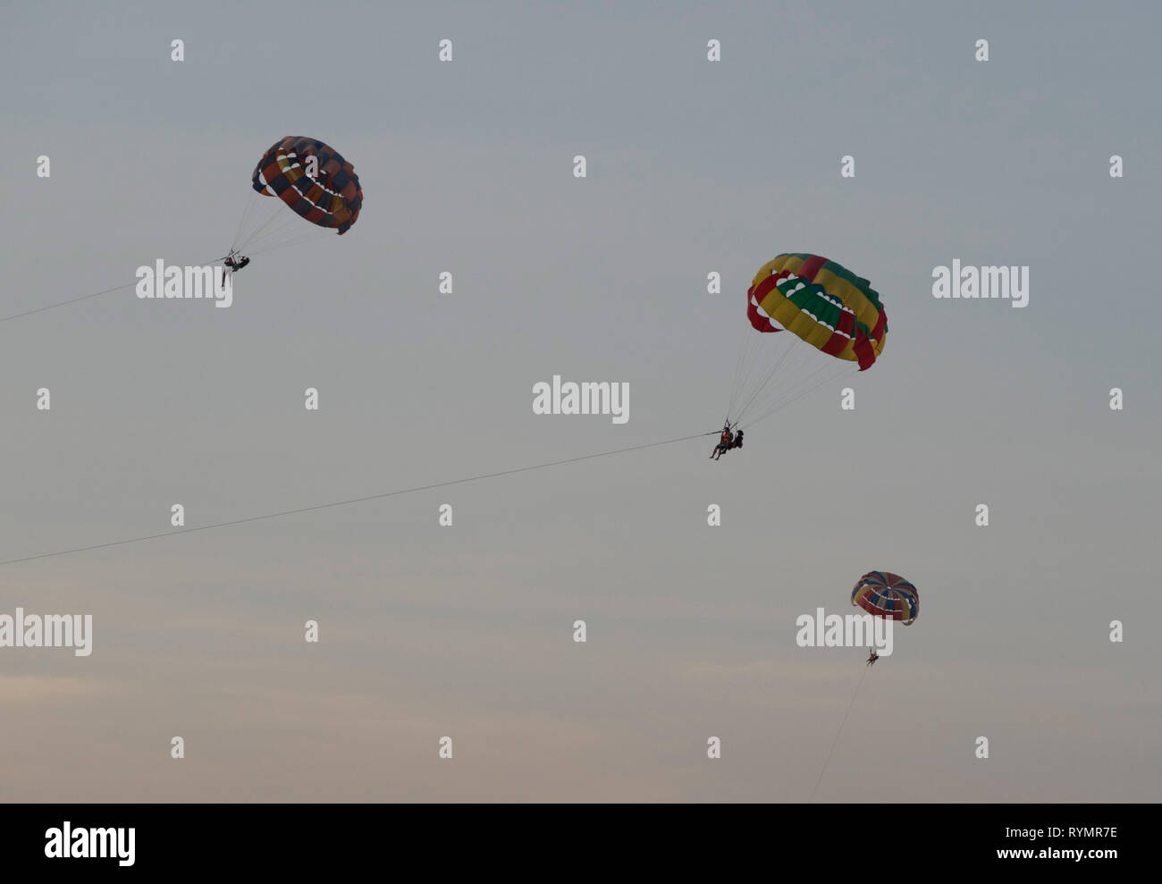Western tourists sky gliding on a beach in the island of Langkawi ...
