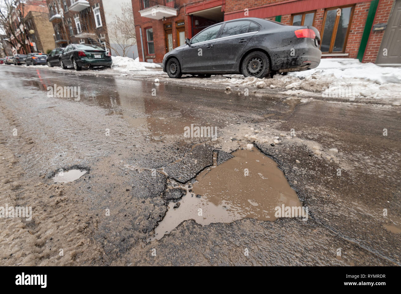 Montreal, CA - 13 March 2019: Large pothole in Montreal street, in ...