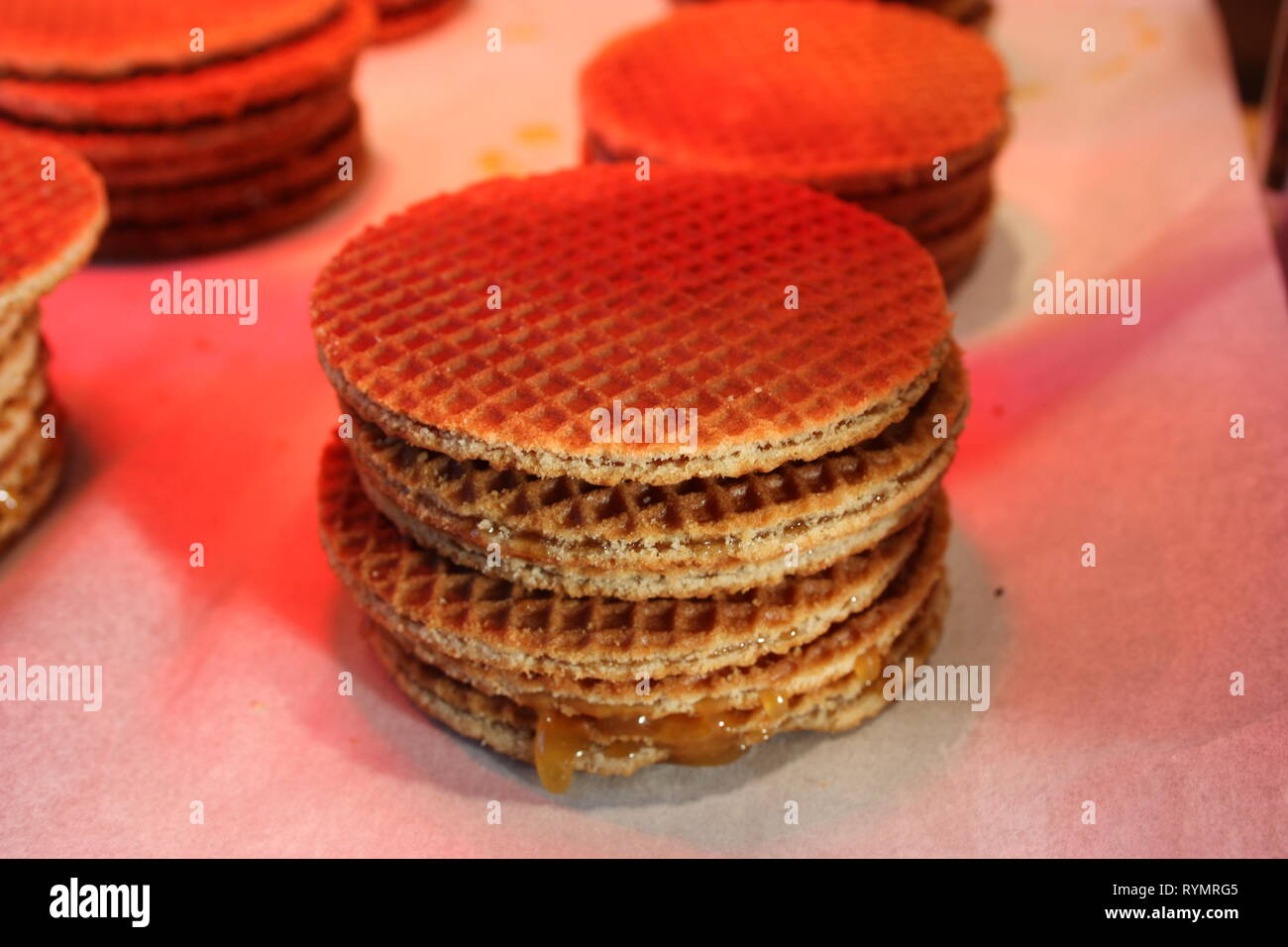 stroopwafel, typical Dutch sweet. biscuits arranged in a row stacked on ...