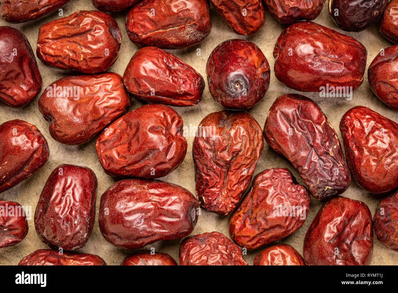 dried jujube fruits on textured bark paper, top view Stock Photo - Alamy