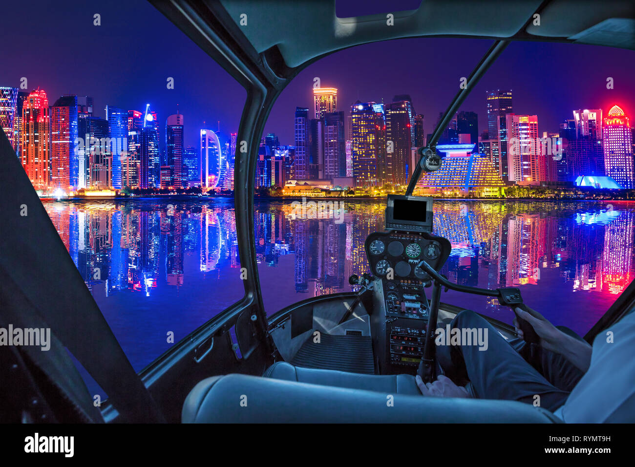 Helicopter cockpit interior flying on Skyline of Doha in Qatar in the ...