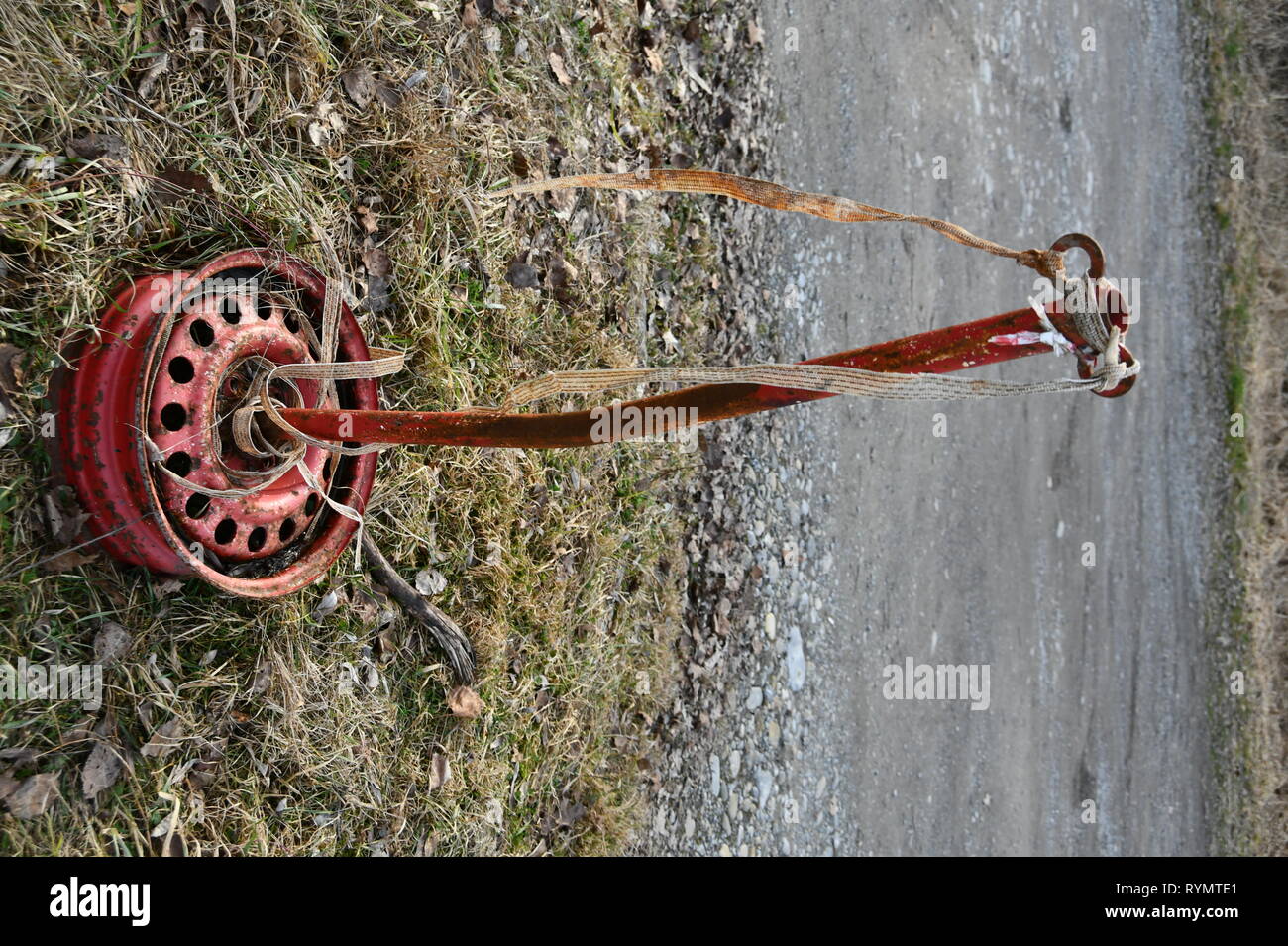 self constructed red painted old and rusty pillar Stock Photo - Alamy