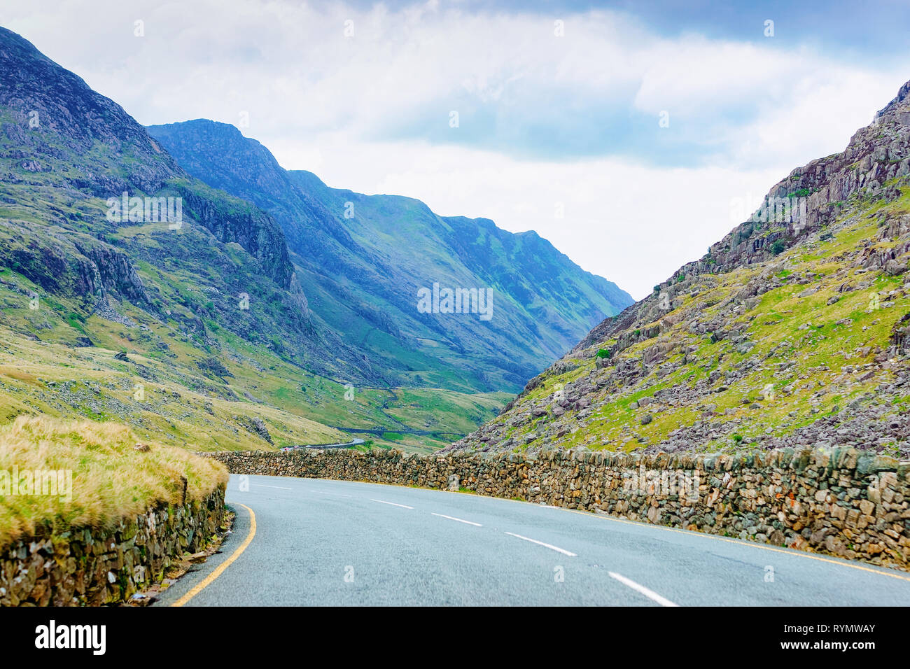 Road with mountains near Snowdonia National Park in North Wales in ...
