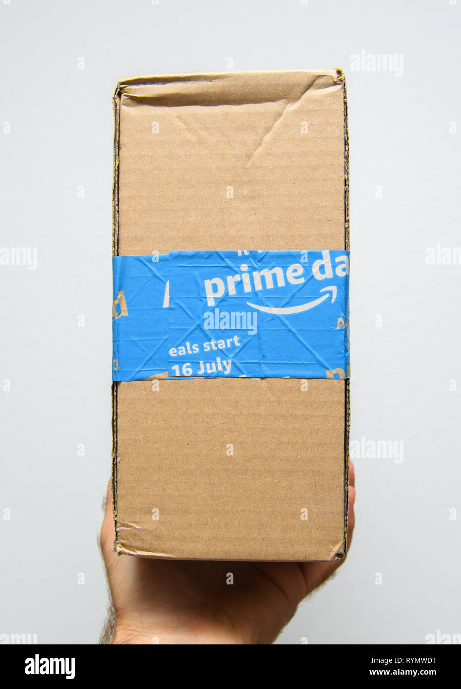 Paris, France - Jul 11, 2018: Man hand holding against white background ...