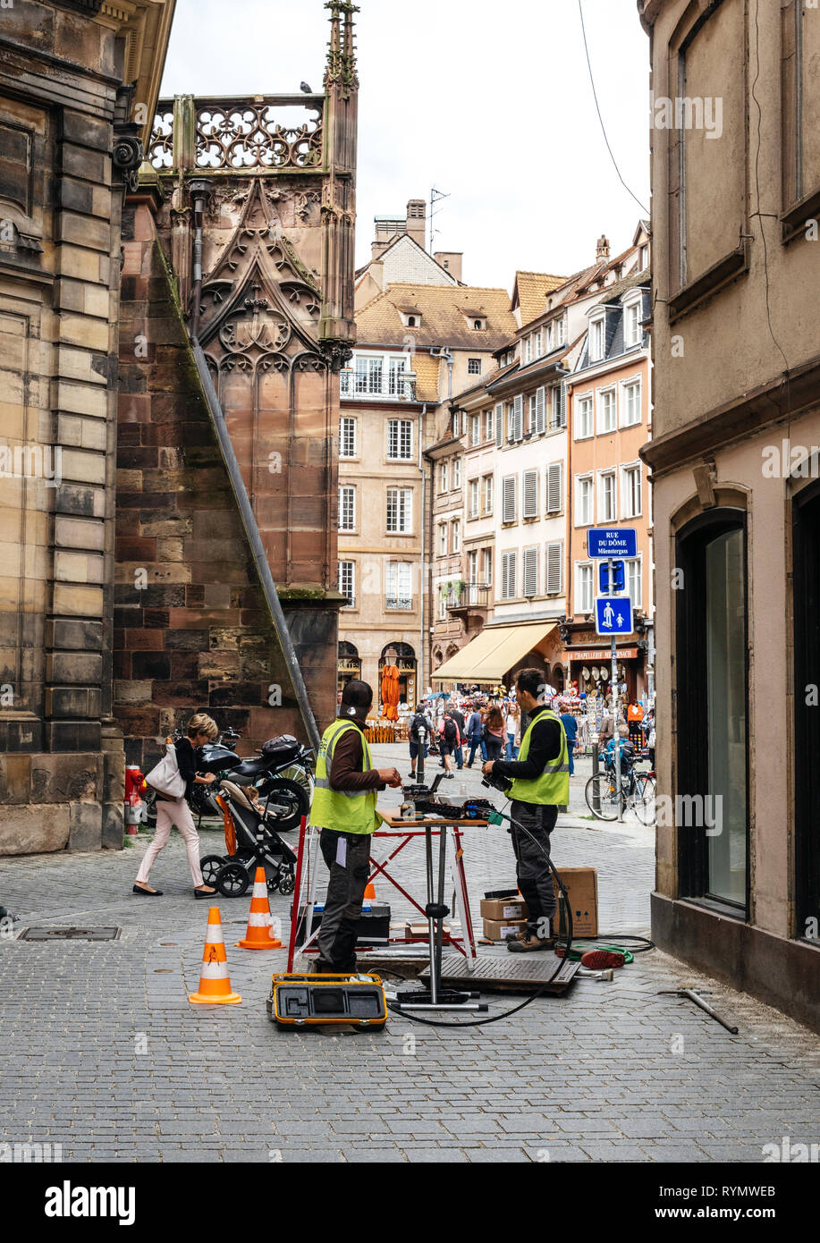 Paris, France - June 13, 2018: Team working near open sewage manhole ...