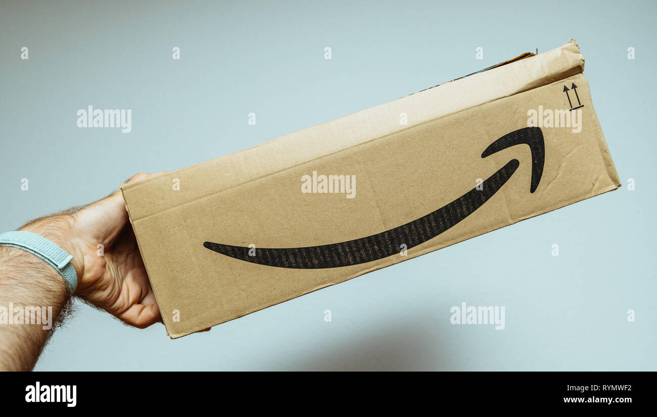 Paris, France - Jun 11, 2018: Man hand holding new freshly delivered ...