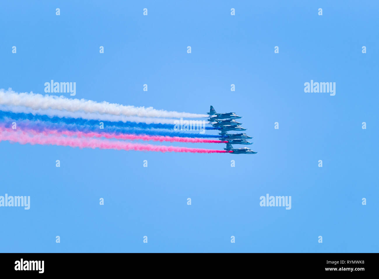 Military plane aircrafts flight in the blue sky. Making a russian flag ...