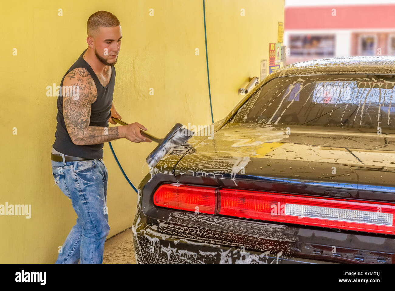 Guy washing car wash hi-res stock photography and images - Alamy