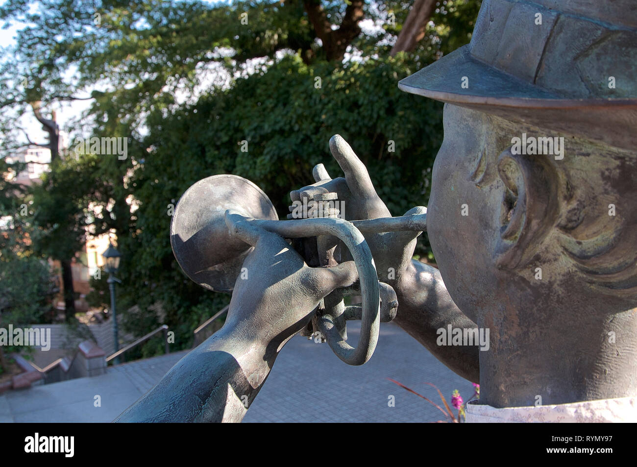 Rear close up picture of a trumpet player statue in the Kitano district ...