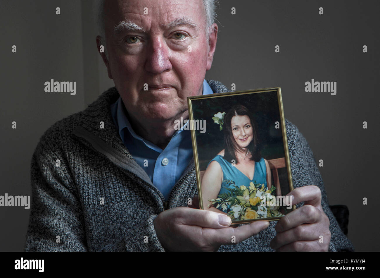 Peter Lawrence, photographed at his home near York, holds a photograph ...