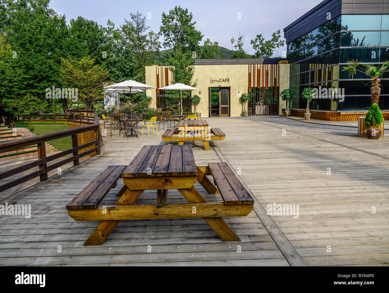 Nami, South Korea - Feb 6, 2015. Outdoor coffee shop with many chairs ...