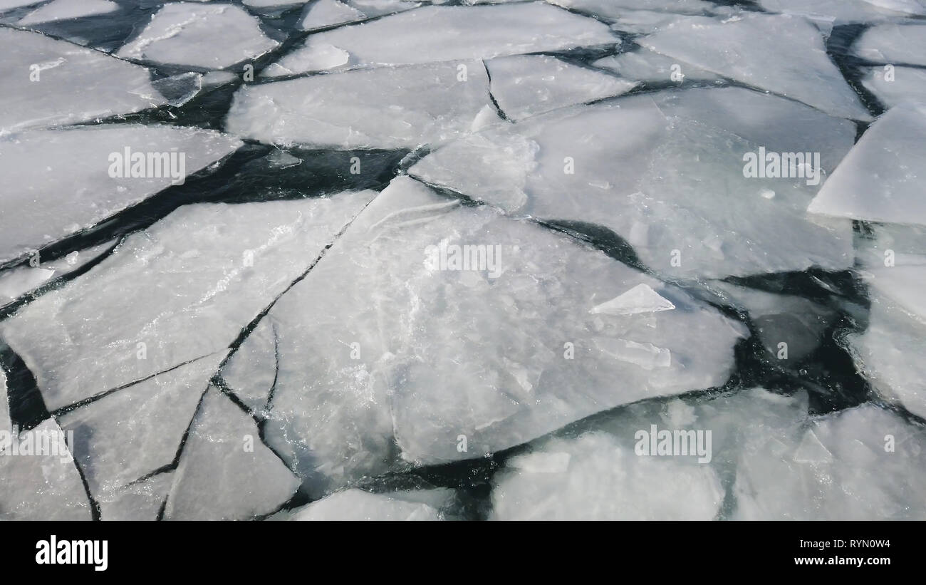 Frozen surface of the ocean cracked. extreme weather Stock Photo - Alamy