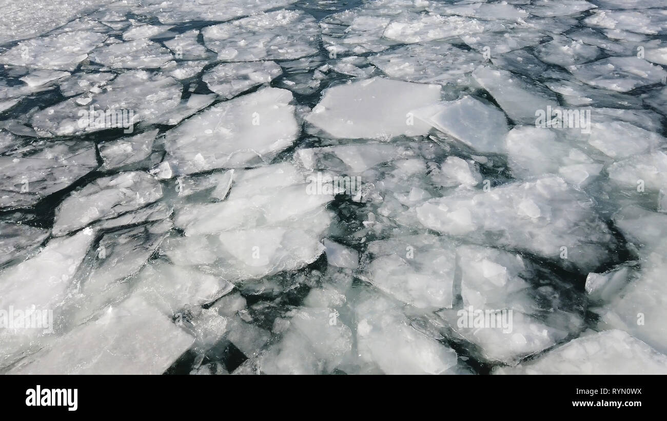 surface of the ocean covered in cracked and melting ice Stock Photo - Alamy