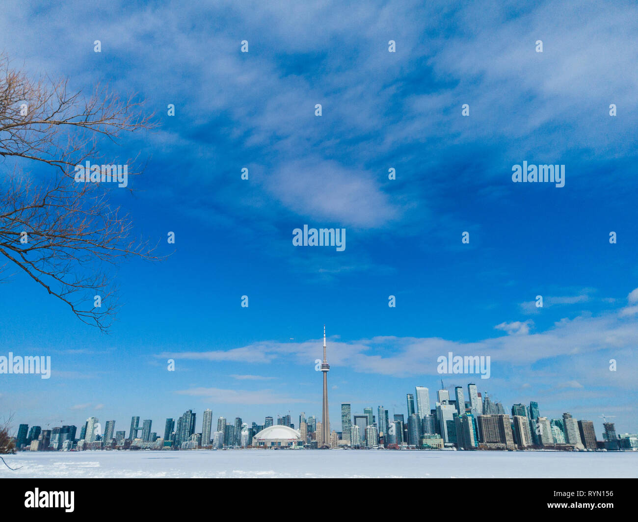 Toronto city skyline seen from toronto Islands over frozen lake Ontario ...