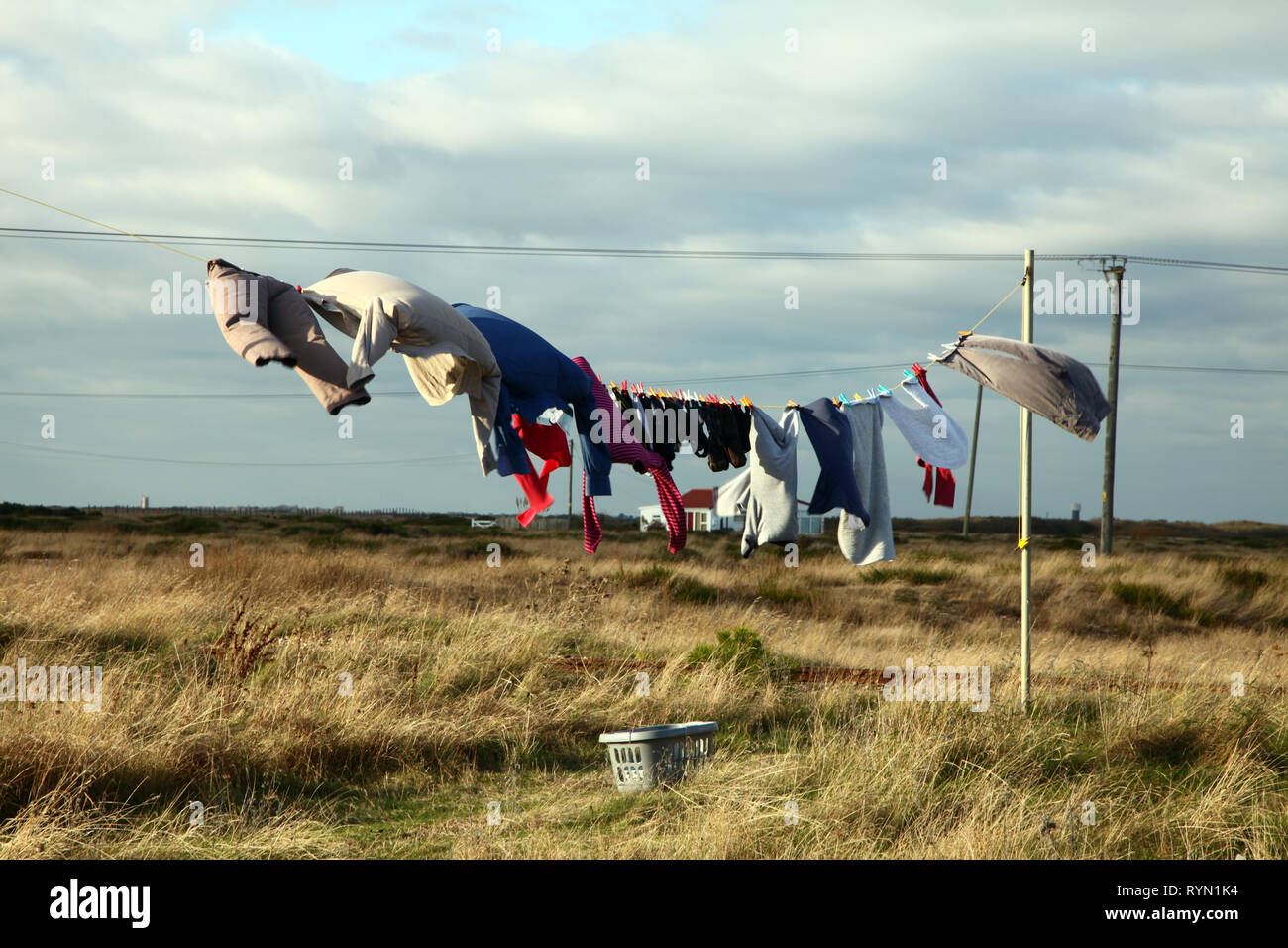Line of washing blowing in a strong wind at Dungeness Kent England ...