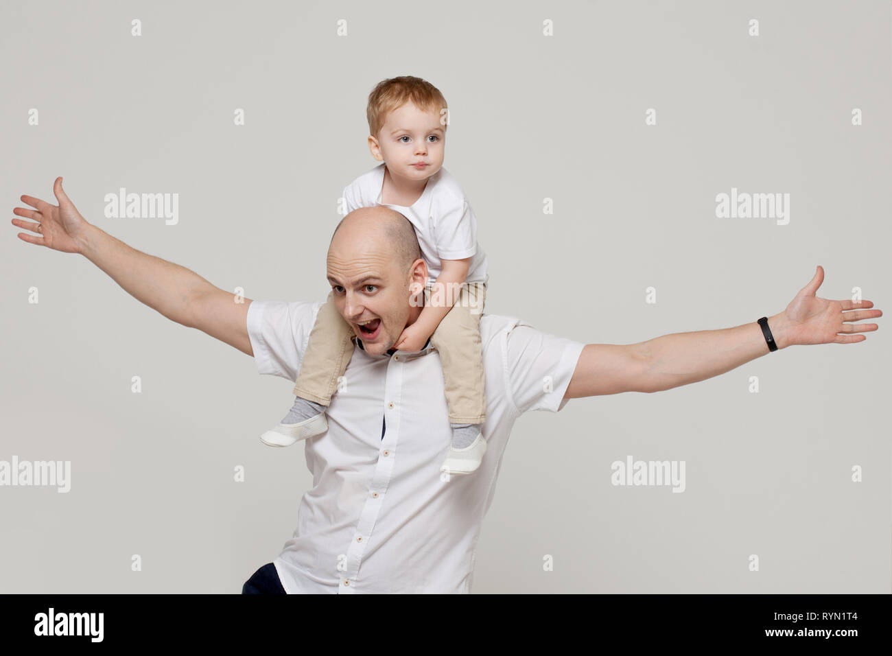 father and his son, the young man raising children, the concept ...