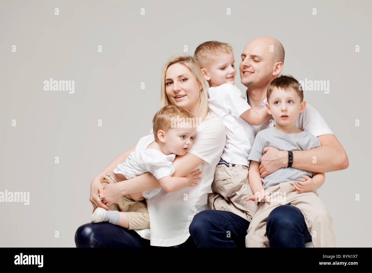 Big and cheerful family, mom dad and three sons. Happy together. family ...