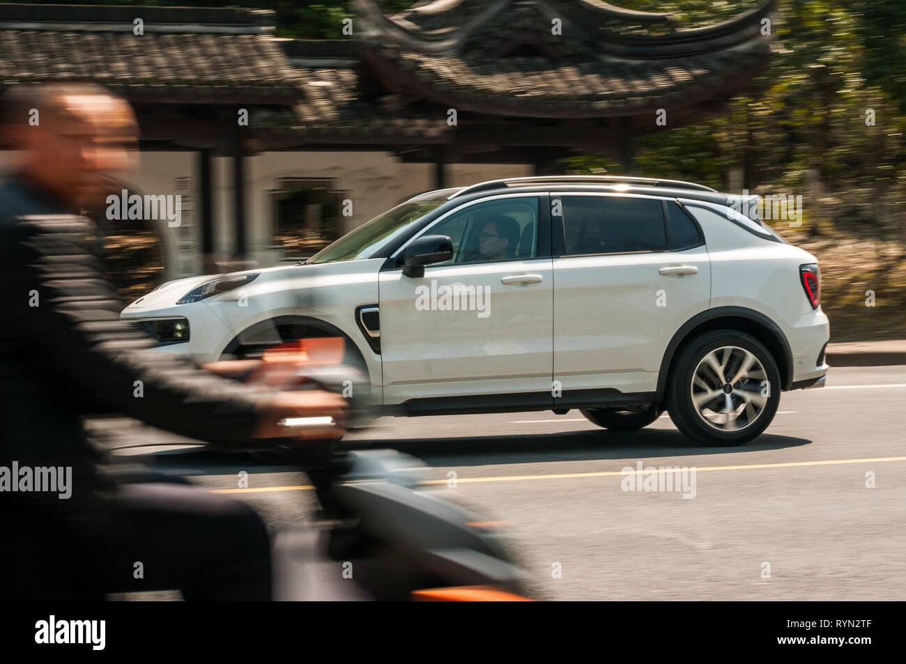 Young chinese man driving car hi-res stock photography and images - Alamy
