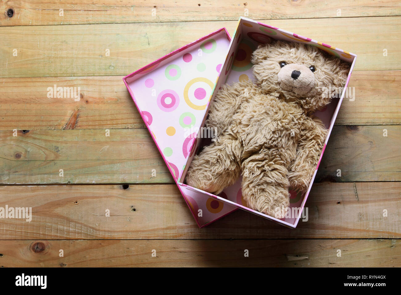 Teddy Bear on Wooden Background Stock Photo - Alamy