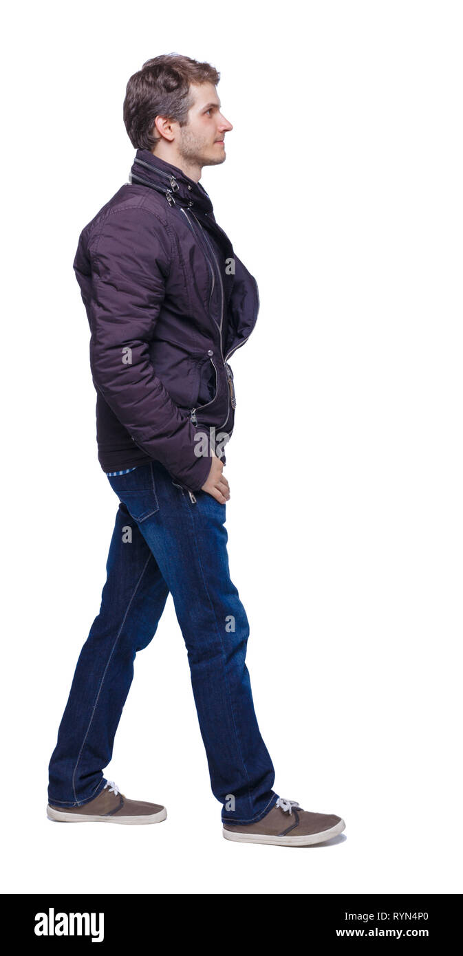 Side view of going handsome man in jeans and jacket. walking young guy ...