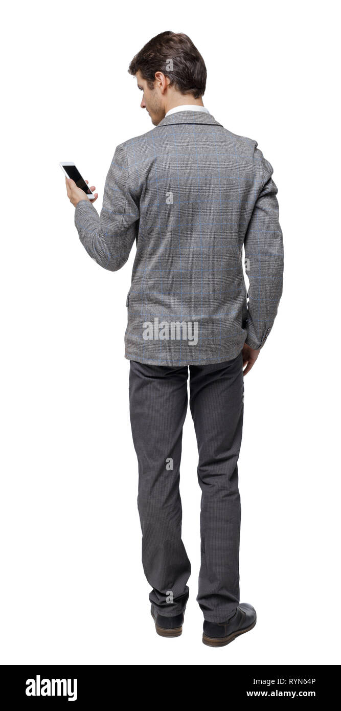Back view of a businessman who is looking into the smartphone. rear ...