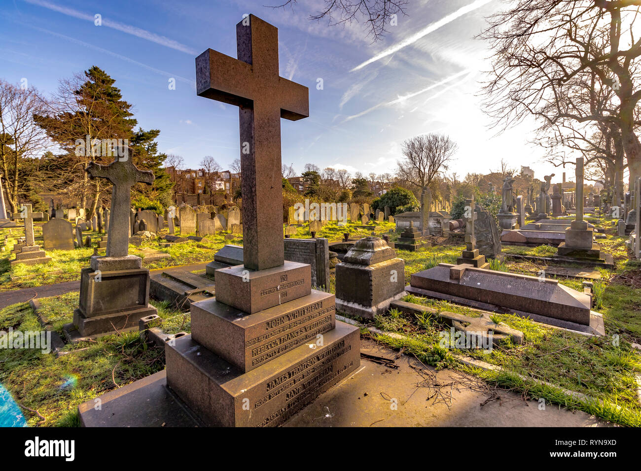 A large stone cross on a grave in Brompton Cemetery in the Royal ...