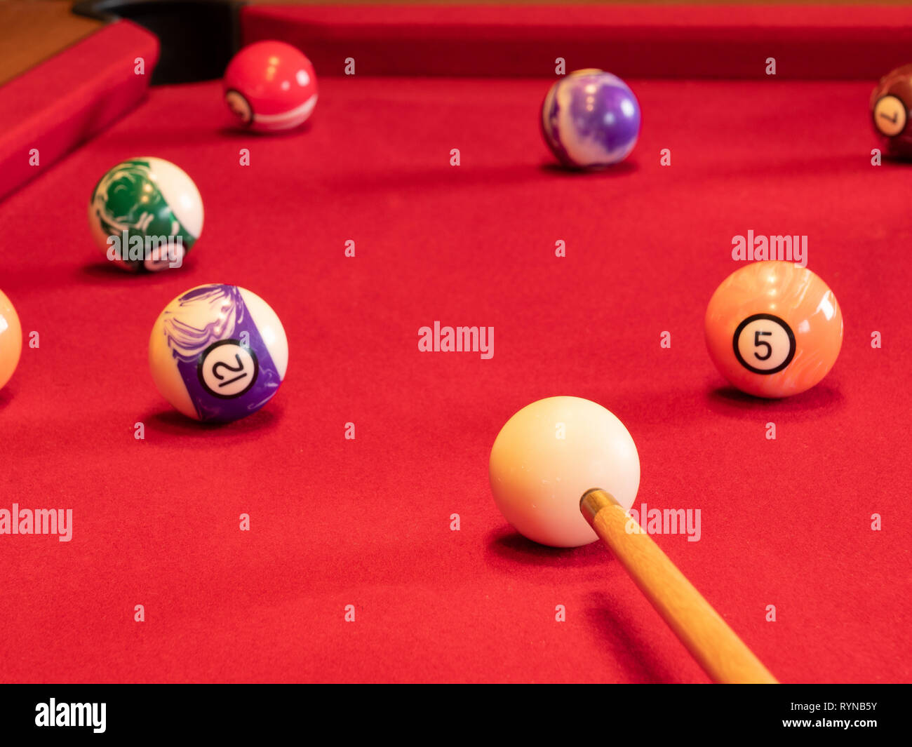 Playing a game of pool Stock Photo - Alamy