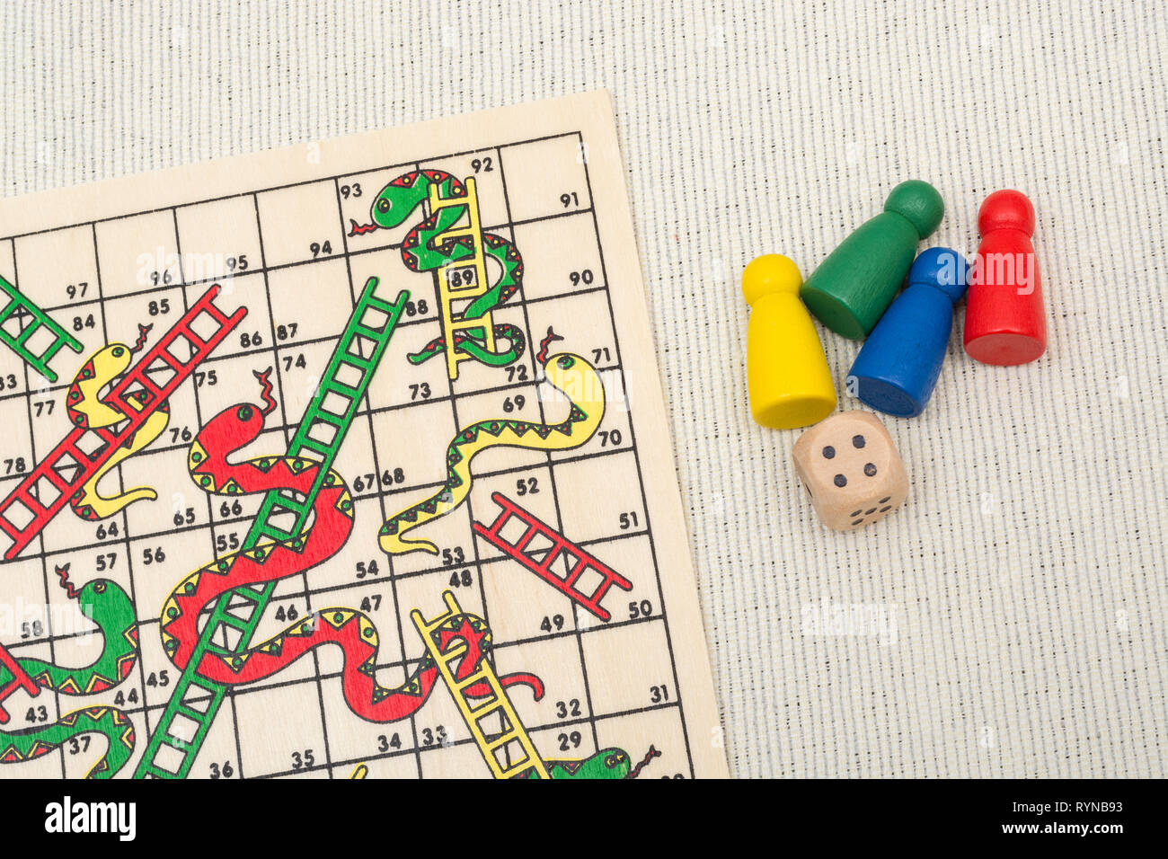 Close-up of small Snakes and Ladders game / board game For climbing ...