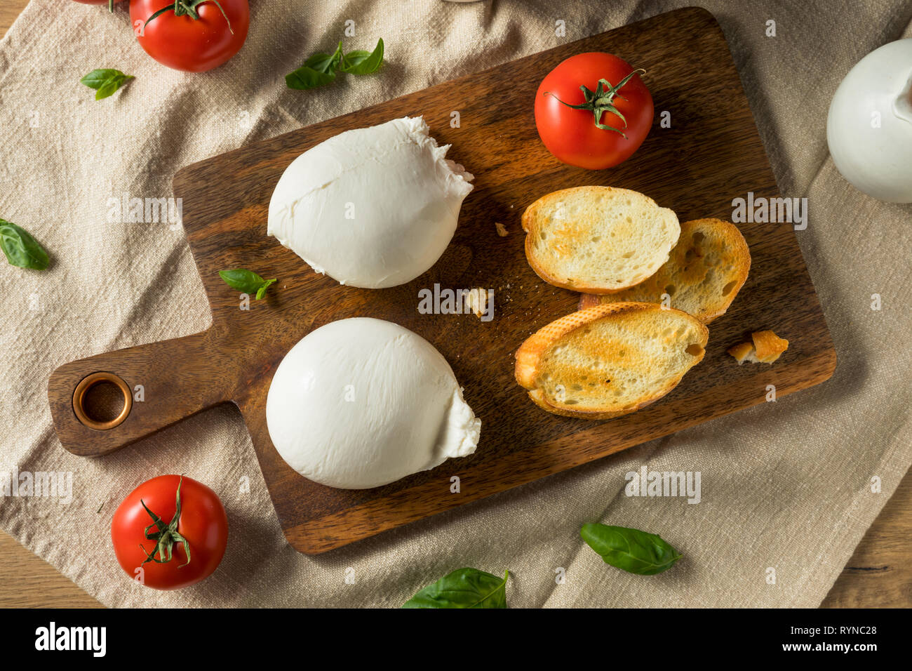 Homemade White Italian Burrata Cheese with Tomato and Basil Stock Photo ...