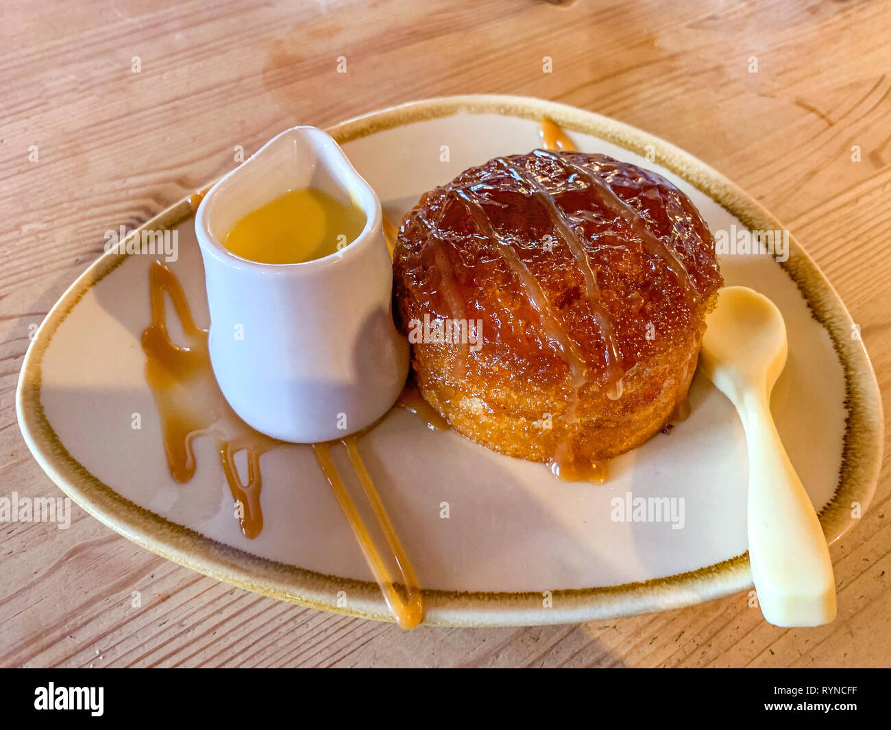 Syrup sponge with custard dessert Stock Photo - Alamy