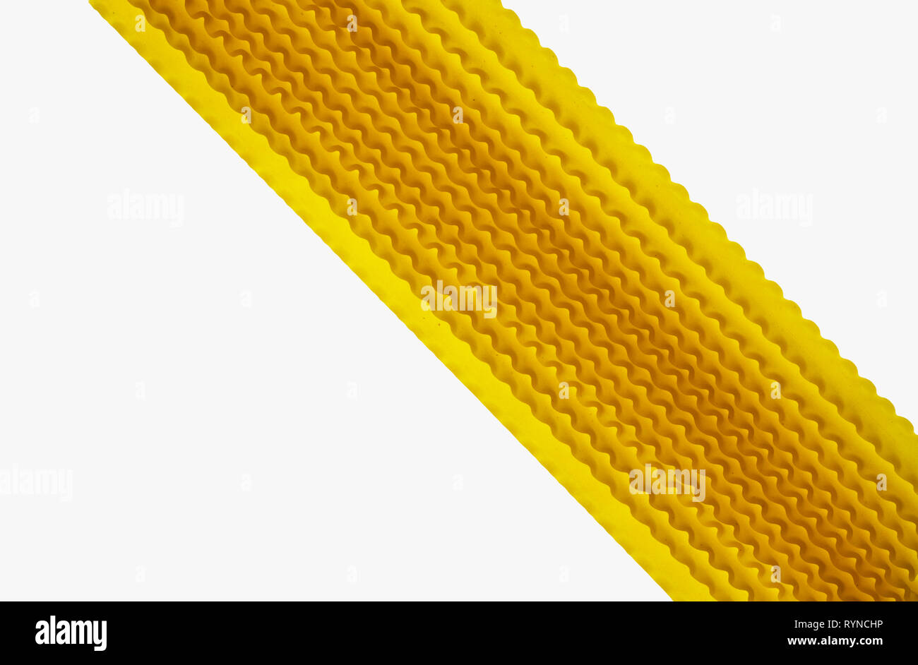 Raw Italian pasta called mafaldine on a white background , flat and ...