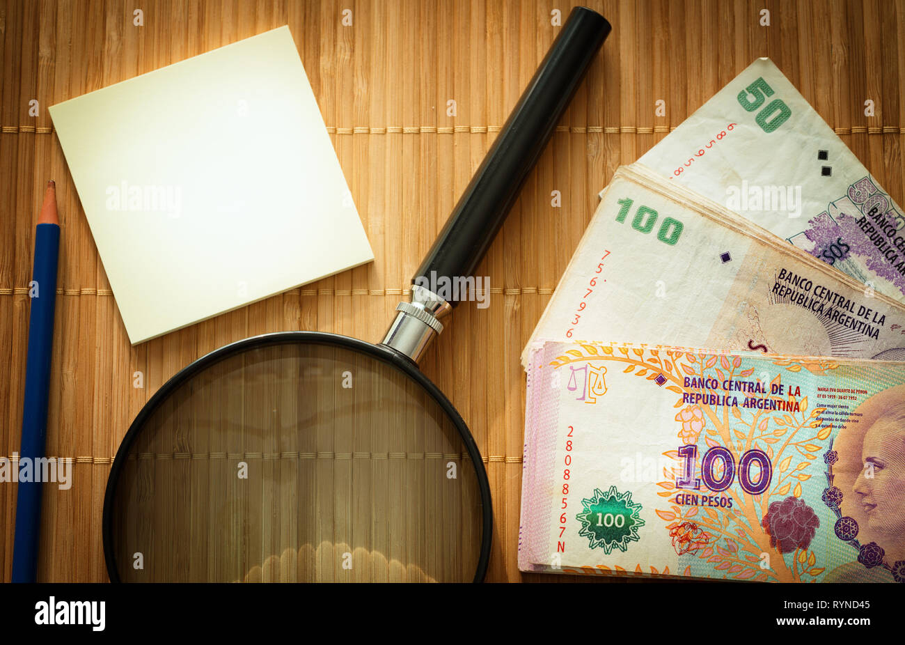 Argentine money, pesos on the table with a white blank card, a ...