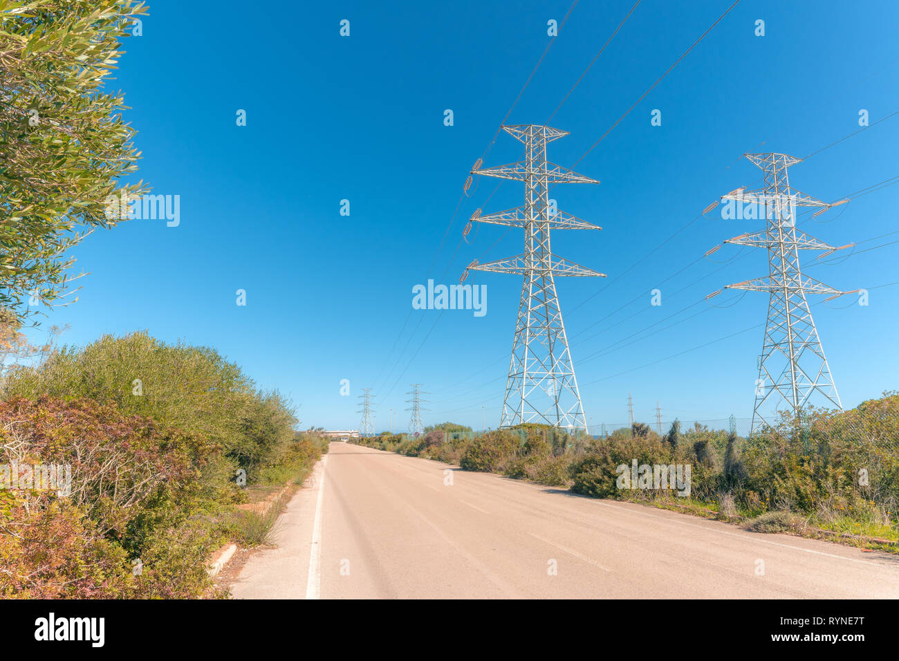 Country road high voltage pylon hi-res stock photography and images - Alamy