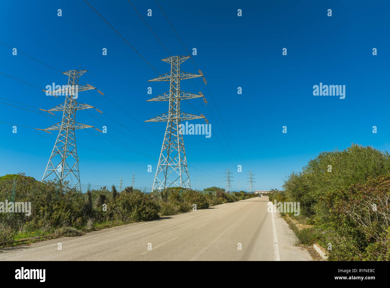 Country road high voltage pylon hi-res stock photography and images - Alamy