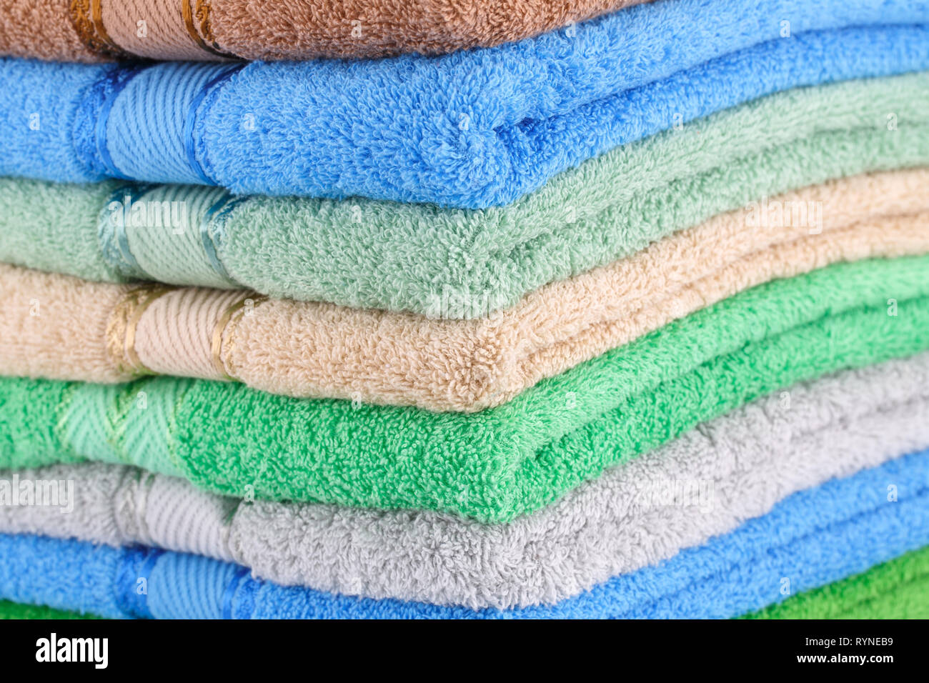 Colorful towels stack closeup picture Stock Photo - Alamy